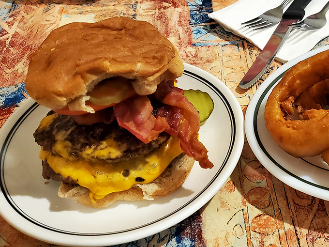 This isn't just a burger&mdash;it's edible architecture. Melted cheese cascading over the patty like a yellow waterfall of deliciousness, all on a perfectly toasted bun.