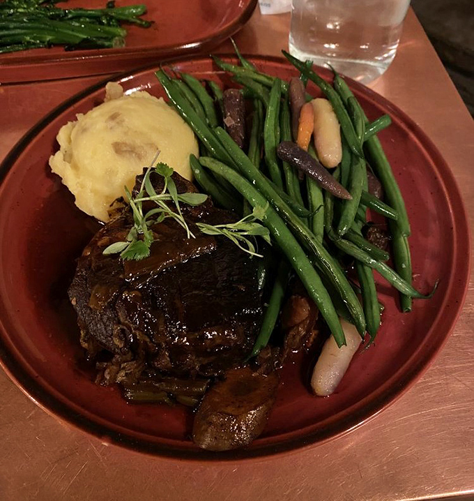 Bison pot roast that would make even the most hardened trail boss weep with joy &ndash; fork-tender meat swimming in rich sauce.