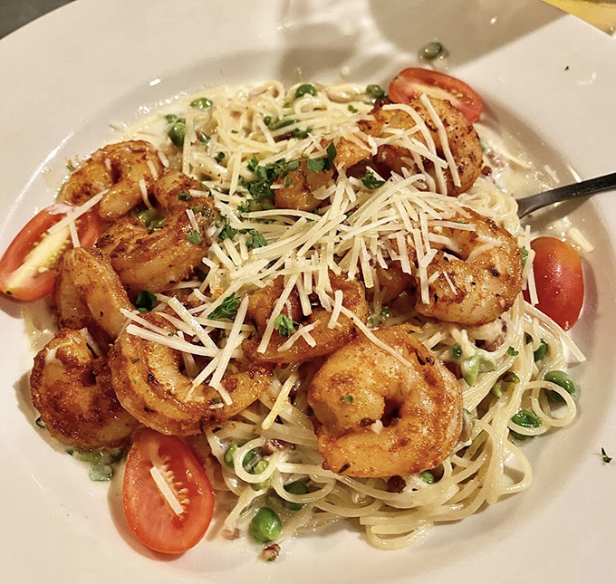 Blackened shrimp carbonara combines bold flavors with creamy pasta in a dish that's pure comfort food poetry.