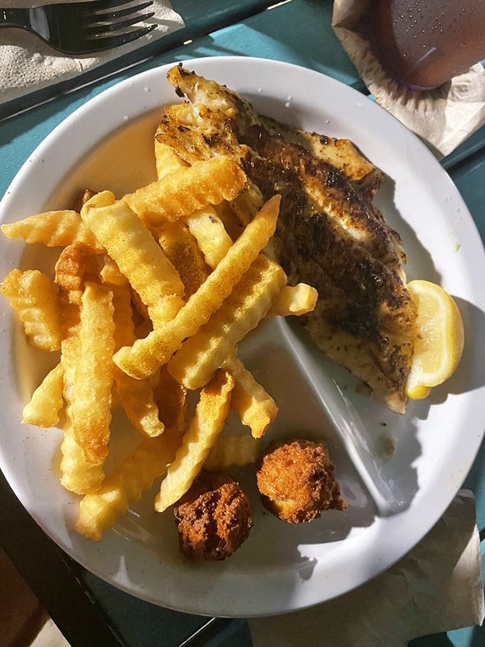 Blackened triggerfish that didn't get the memo about being subtle. Those crispy fries are the perfect supporting cast for this seasoned star.