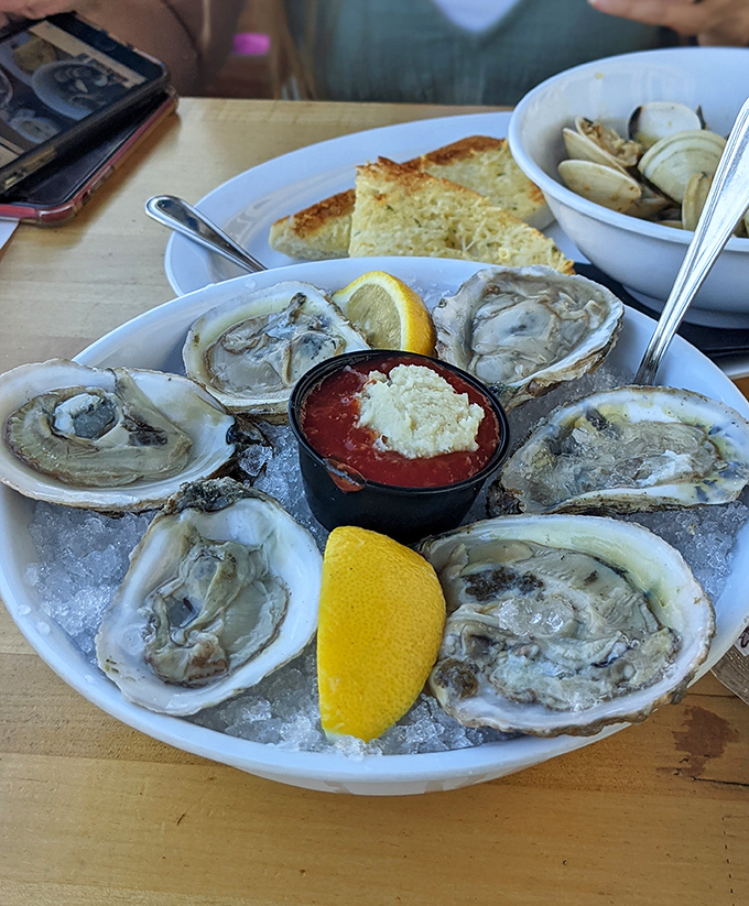 The ocean's perfect appetizer&mdash;fresh oysters on ice with lemon wedges standing by, ready for their moment of zesty glory.
