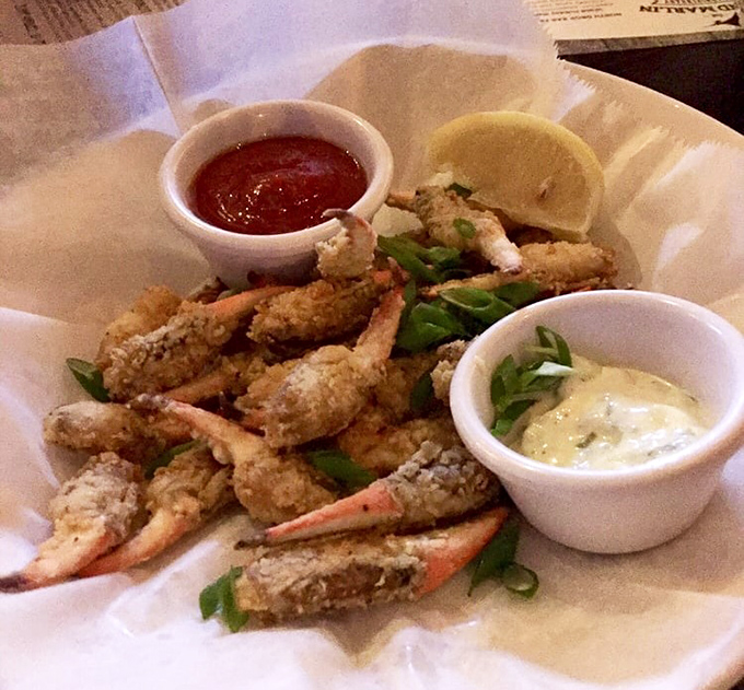 Blue crab claws &ndash; where delicate seafood meets comfort food. These golden-fried treasures make you forget you ever needed utensils in the first place.