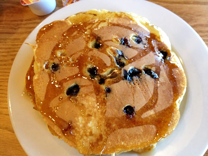 Blueberry pancakes that look like they're auditioning for a breakfast cereal commercial &ndash; golden, fluffy, and studded with berries that burst with every bite.