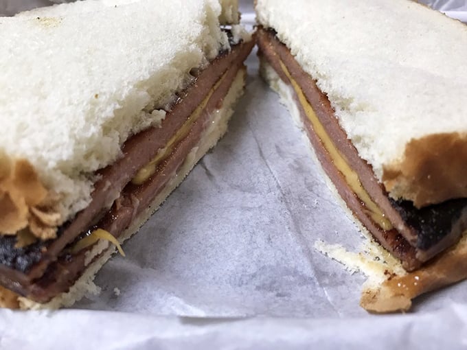 The humble bologna sandwich, elevated to art form with thick-cut meat and melty cheese between pillowy white bread.