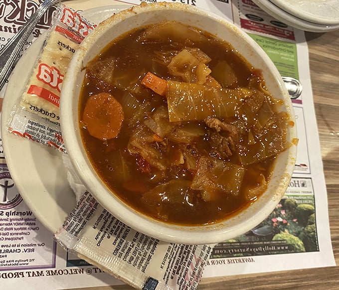 A hearty bowl of cabbage borscht that connects you to generations of comfort cooking. Each spoonful tells a story of tradition and satisfying simplicity.