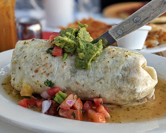 The breakfast burrito &ndash; a perfect cylinder of morning joy, where avocado, salsa, and what's wrapped inside create a portable feast worth waking up for.