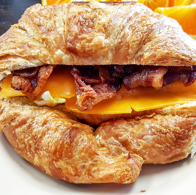 The breakfast croissant sandwich – because sometimes you need something savory before diving into the sweet stuff. Balance, people!