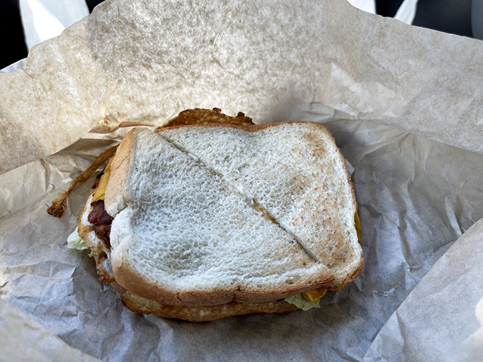 The breakfast sandwich: humanity's greatest portable invention since the wheel, wrapped in wax paper like the simple gift it is.