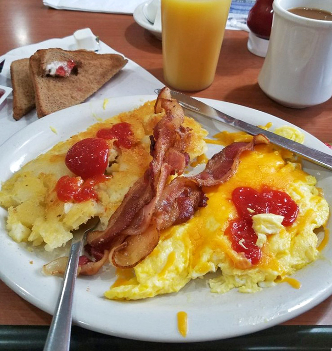The breakfast that launched a thousand road trips: farm-fresh eggs, crispy bacon, and hash browns with just the right amount of ketchup.