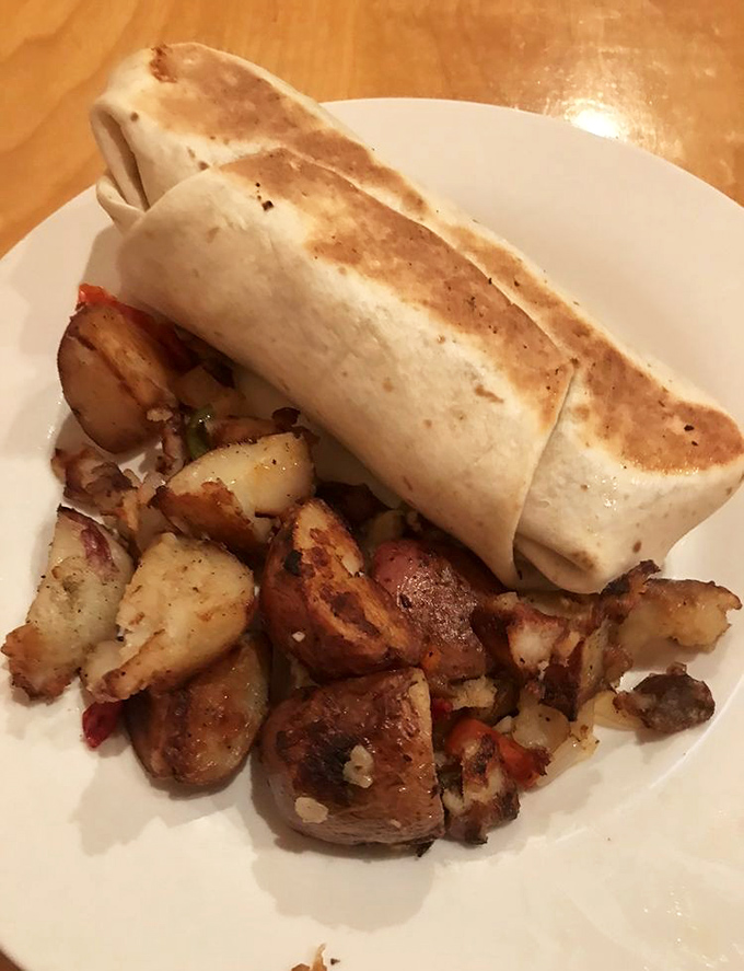 Breakfast meets lunch in this hearty burrito served with perfectly seasoned potatoes &ndash; morning fuel that keeps you going until dinner.