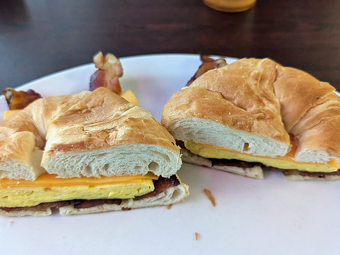 The breakfast croissant sandwich elevates the morning meal to French-inspired heights of buttery, flaky, egg-filled excellence and satisfaction.