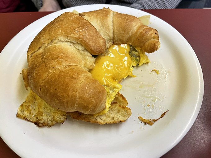 The humble croissant sandwich&mdash;where buttery pastry meets molten egg and becomes the handheld breakfast of champions.