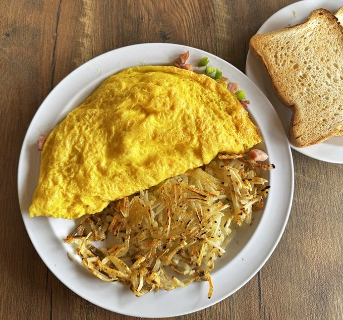 This perfect omelet with crispy hash browns could make even a night owl reconsider their stance on morning meals.