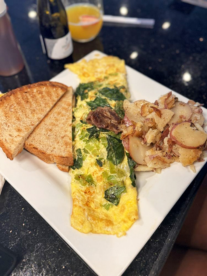 A breakfast plate so perfectly composed it deserves its own museum exhibit and standing ovation.