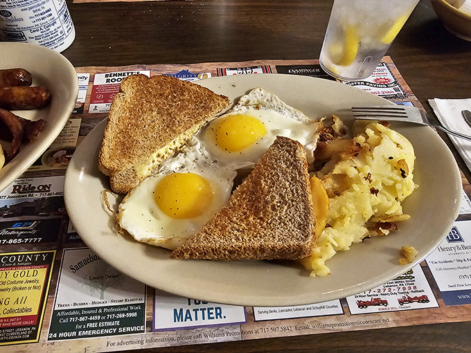 Breakfast of champions: perfectly sunny-side-up eggs, golden toast, and home fries that could make a morning person out of anyone.