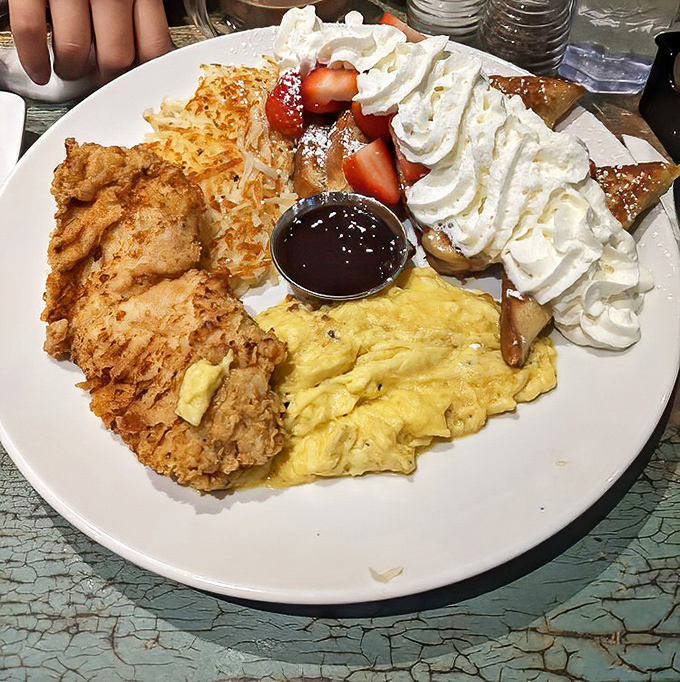 The breakfast platter that answers the eternal question: "Why choose one thing when you can have everything?" Eggs, chicken, pancakes, and pure joy.