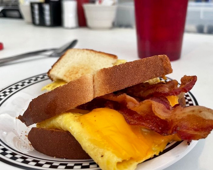 The breakfast sandwich that makes you question why we ever complicated things with avocado and sriracha. Simple perfection.