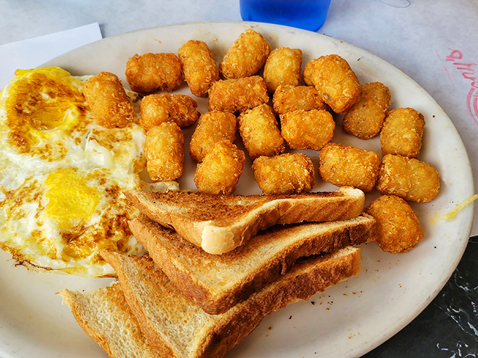 Tater tots: proving that potatoes achieve their highest purpose when transformed into golden, crispy nuggets of breakfast joy.