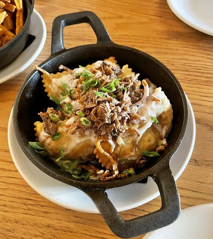 Pierogies that would make your Polish grandmother weep with joy. Topped with tender brisket and green onions, they're comfort food with a PhD.