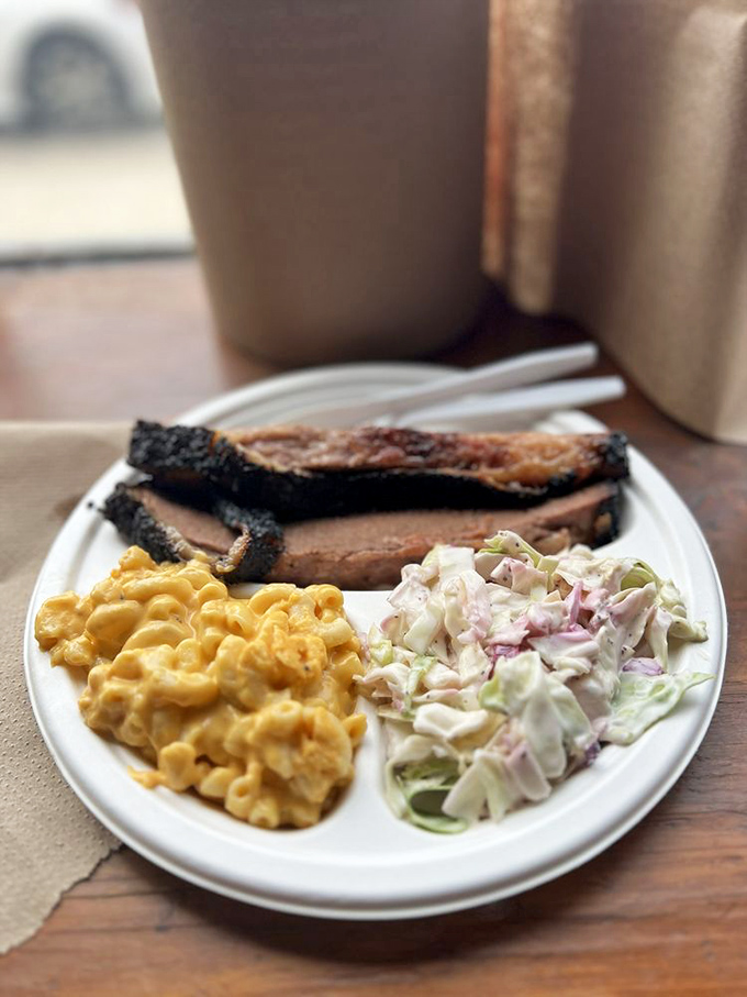 The holy trinity: brisket, mac and cheese, and coleslaw. A balanced meal if balance means "makes your taste buds do a happy dance."