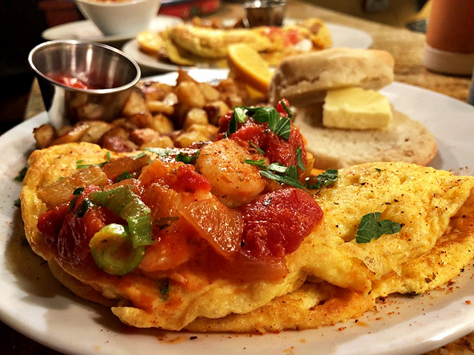 An omelet that's dressed for Mardi Gras with all those colorful vegetables. This isn't your sad diner breakfast&mdash;it's morning cuisine with ambition.