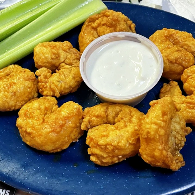 Buffalo shrimp: when two perfect food groups collide. These golden morsels deliver that perfect kick without sending you running for the water cooler.
