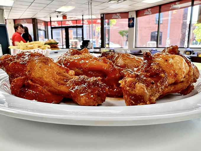 Buffalo wings glazed to perfection, proving that sometimes the best surprises come from unexpected menu additions at hot dog joints.