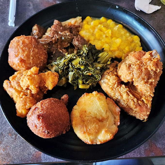 Southern comfort on a plate. Those collard greens and fried chicken have been perfecting their relationship for generations. 