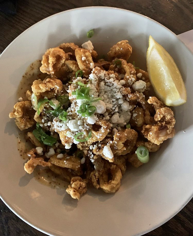 Calamari so perfectly fried it makes you wonder if the chef has some sort of pact with the seafood gods. The lemon wedge is just showing off.