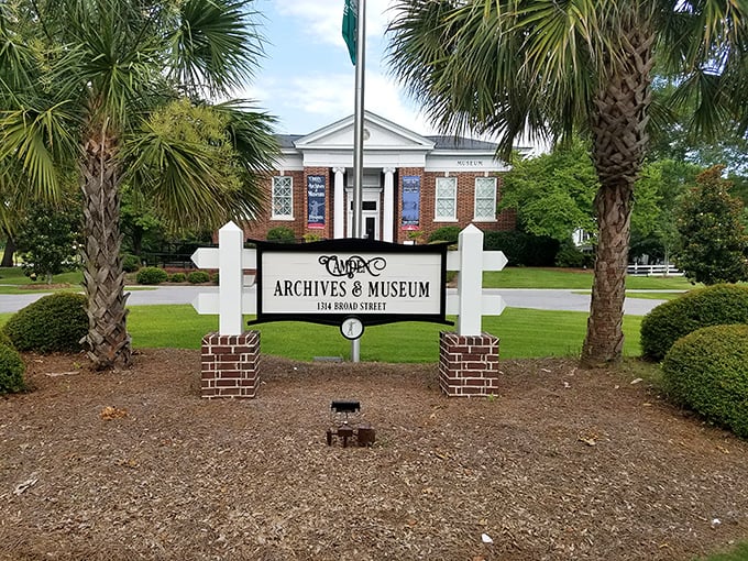 The Archives & Museum doesn't just preserve Camden's past; it celebrates it between those elegant palm trees and behind that classic white fence.