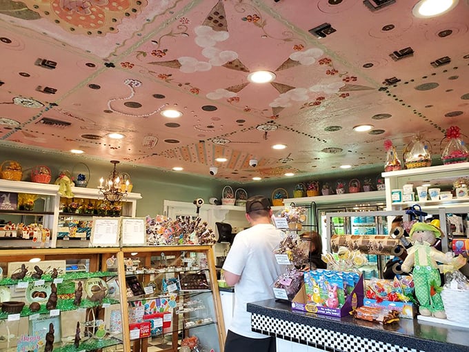 The pink ceiling dotted with whimsical designs watches over a candy wonderland that Willy Wonka himself would approve of.