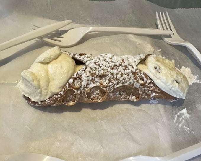 Sweet endings come in flaky packages. This cannoli is the dessert equivalent of a standing ovation &ndash; crisp shell, creamy filling, powdered perfection.