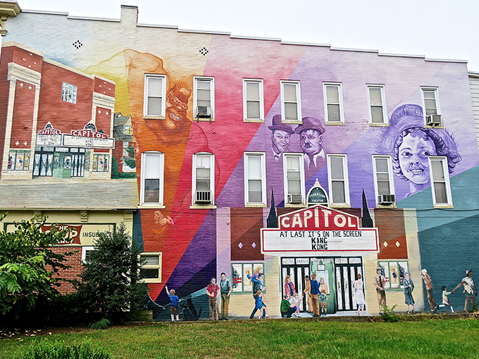This vibrant mural celebrating the Capitol Theatre transforms an ordinary wall into a colorful journey through Milton's entertainment history.