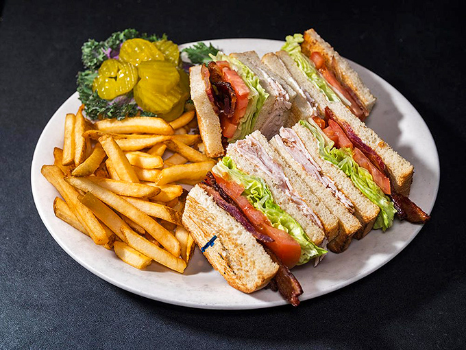 A club sandwich that stands taller than most Hollywood actors' egos, with layers that harmonize like The Beach Boys.