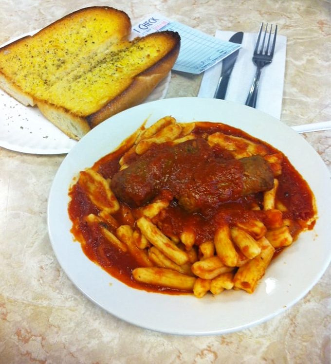 When pasta hugs tomato sauce this lovingly, with a meatball standing guard, you know you've found Italian-American soul food.