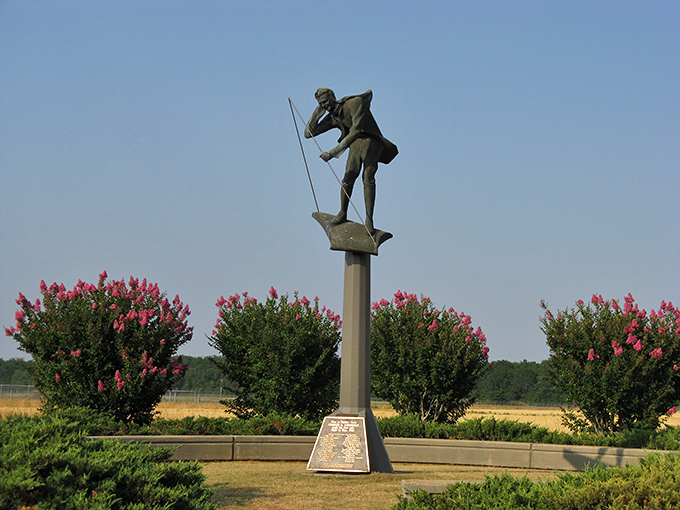 The Charles Lindbergh Monument stands surrounded by crepe myrtles, commemorating when the aviation pioneer's spirit soared through Americus skies.