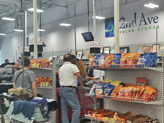 The checkout area awaits with snacks to fuel your shopping marathon. Like reaching base camp after scaling Mount Everest, only with more Cheetos.