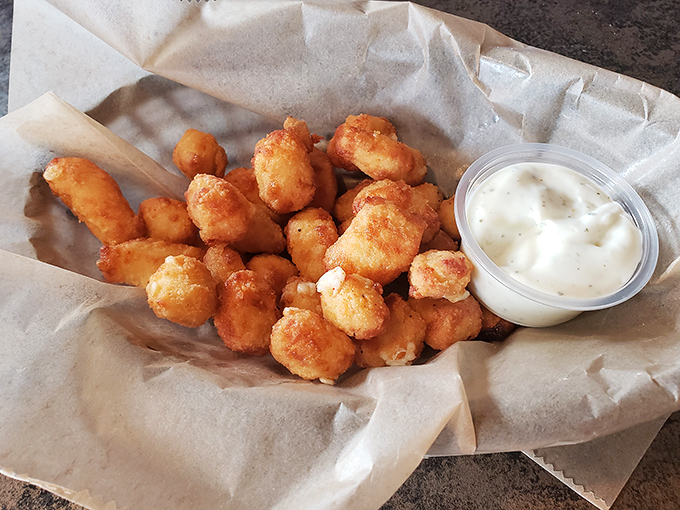 onsin's unofficial state food done right&mdash;cheese curds with that perfect golden crunch giving way to that unmistakable squeaky, melty interior. Resistance is futile. 