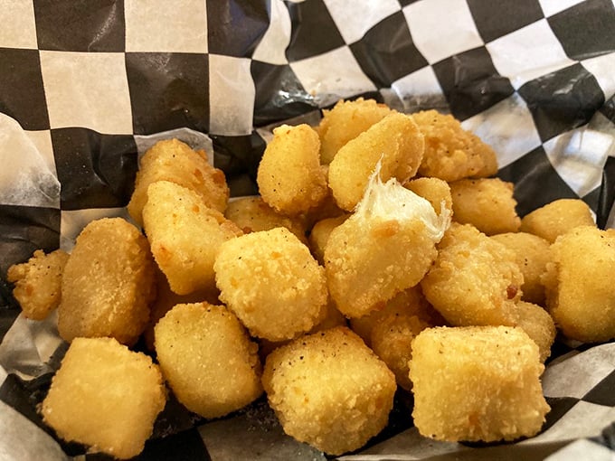 Wisconsin's unofficial state food gets the respect it deserves here: cheese curds fried to golden perfection, ready for their moment of glory.