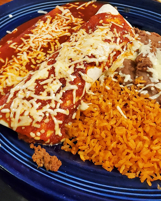 Enchiladas bathed in that brick-red sauce that haunts your dreams. The rice and beans aren't sidekicks&mdash;they're essential supporting actors in this cheesy blockbuster.