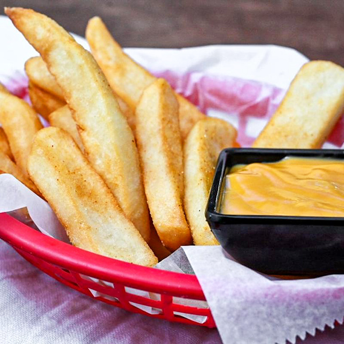 Golden, crispy fries with cheese sauce for dipping &ndash; proof that sometimes the simplest pleasures are worth crossing state lines for.