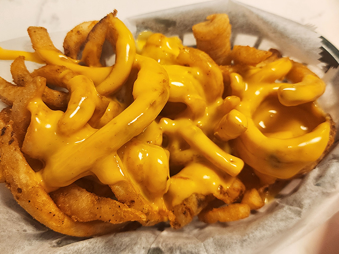 Crinkle-cut fries drowning in liquid gold. If calories don't count when you're experiencing joy, these are practically health food.