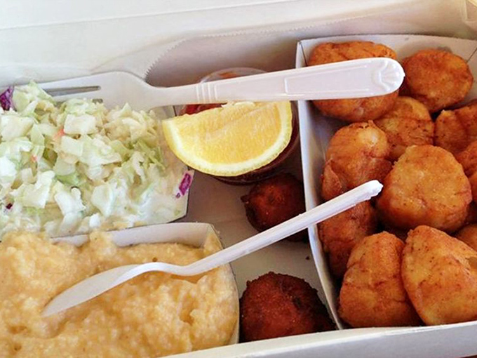 A seafood platter that answers the eternal question: "Why choose one when you can have it all?" The coleslaw provides the illusion of healthiness.