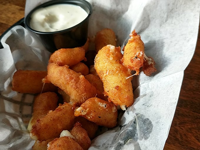 Cheese curds that could make a Frenchman question his loyalty to Gruy&egrave;re, served with a dipping sauce that demands to be explored.