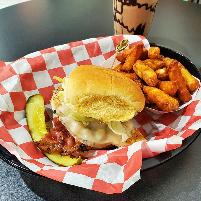 A burger and cheese curds platter that doesn't just satisfy hunger &ndash; it creates memories, complete with the obligatory pickle for your conscience.