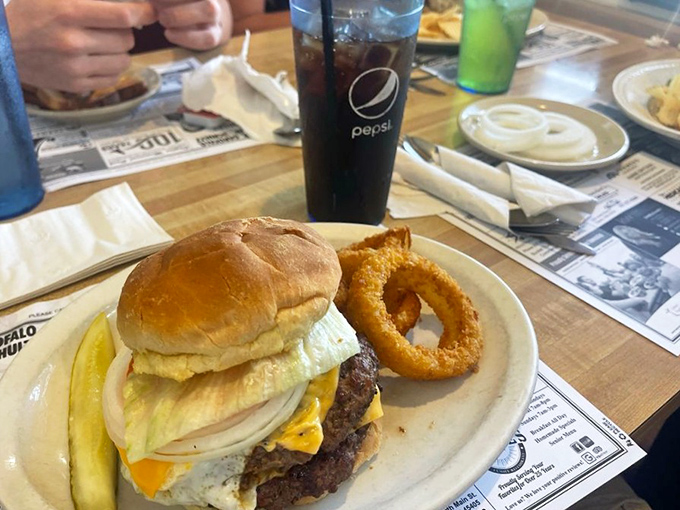 The cheeseburger at George's comes with an onion ring sidekick—because even heroes need partners.