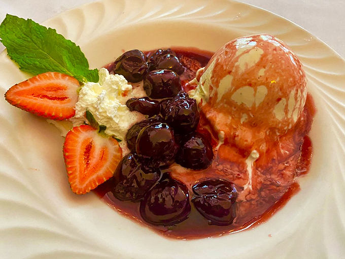 Ice cream and cherries jubilee&mdash;where warm meets cold in a dessert that's been making people smile since your grandparents' first date.