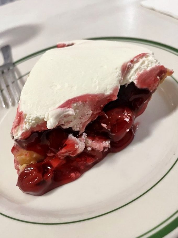 Cherry pie that makes you understand why Agent Cooper was so obsessed. That crimson filling and cloud-like topping are pure dessert poetry.