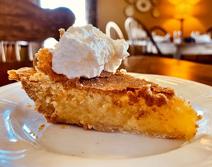 Chess pie topped with whipped cream—a sweet Southern classic that makes you understand why dessert is never optional here.