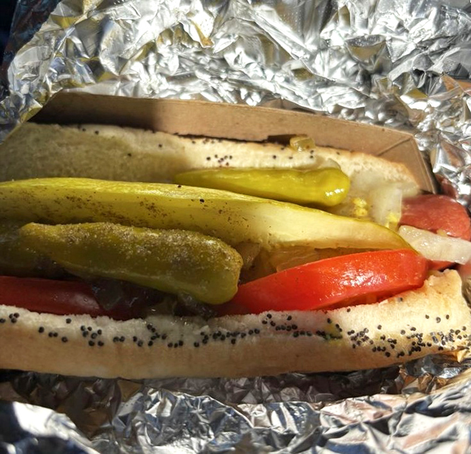 The Chicago dog in its foil throne &ndash; a perfect balance of snap, crunch, and tang that makes Windy City expats weep with joy.